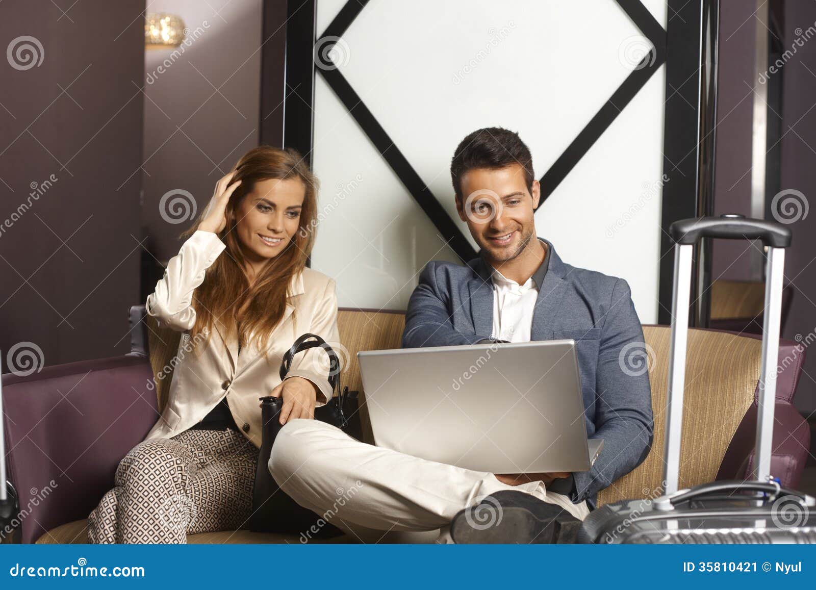 Young Couple Using Laptop at Hotel Lobby Stock Image - Image of counter ...