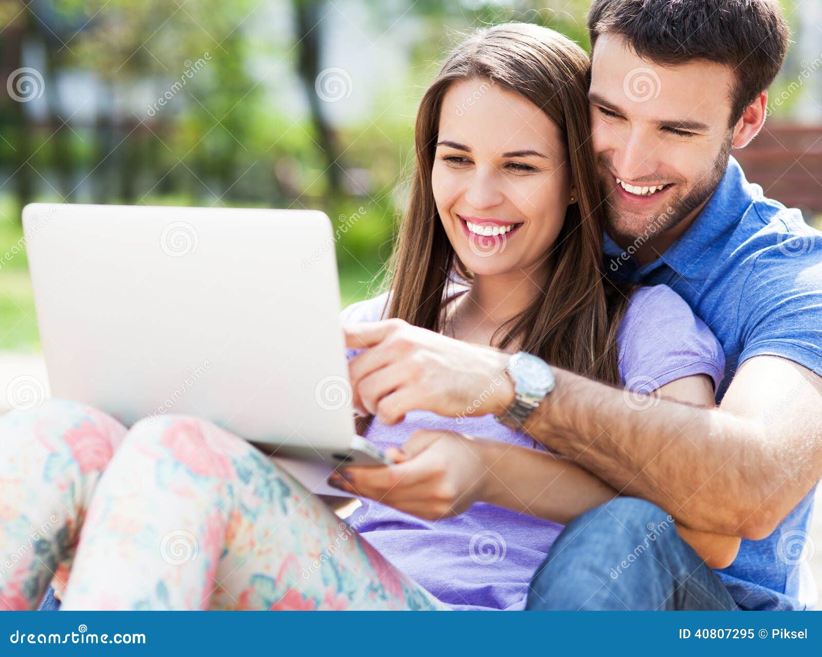Young Couple Using Laptop Outdoors Stock Image - Image of affectionate ...