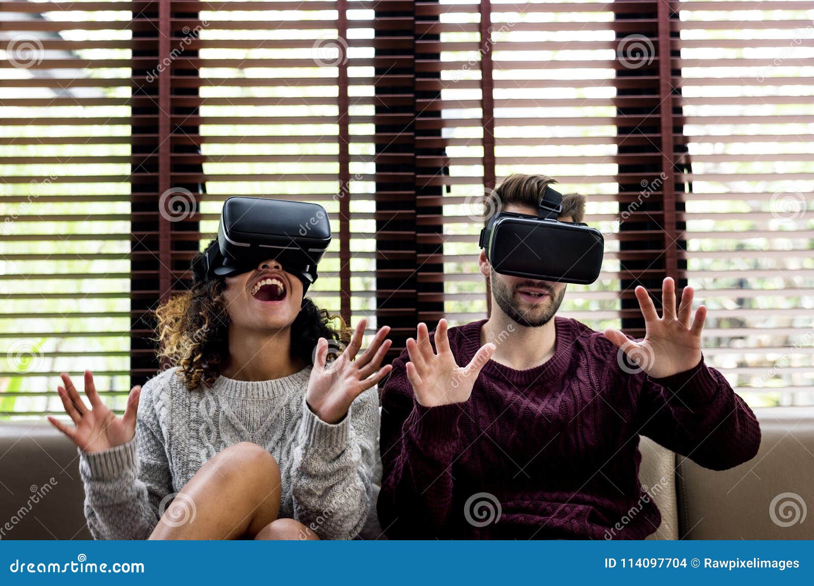 Young Couple Using VR Together Stock Photo - Image of american, couch ...
