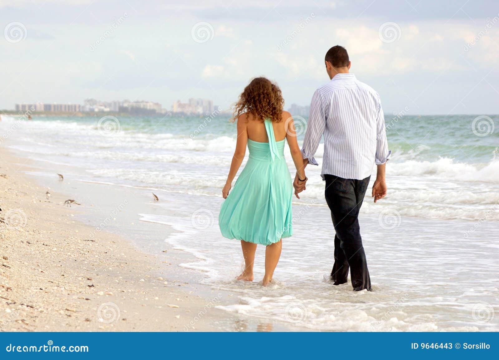 Young Couple Walking Hand in Hand on the Beach Thi Stock Image - Image ...