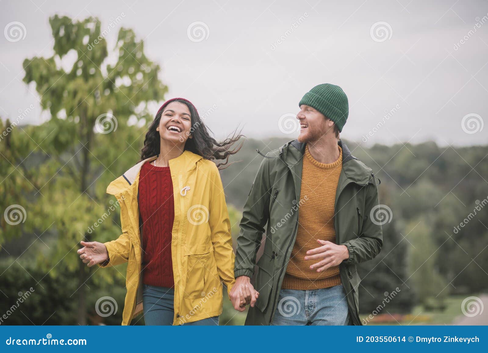Young Couple Walking in the Park and Feeling Happy Stock Photo - Image ...