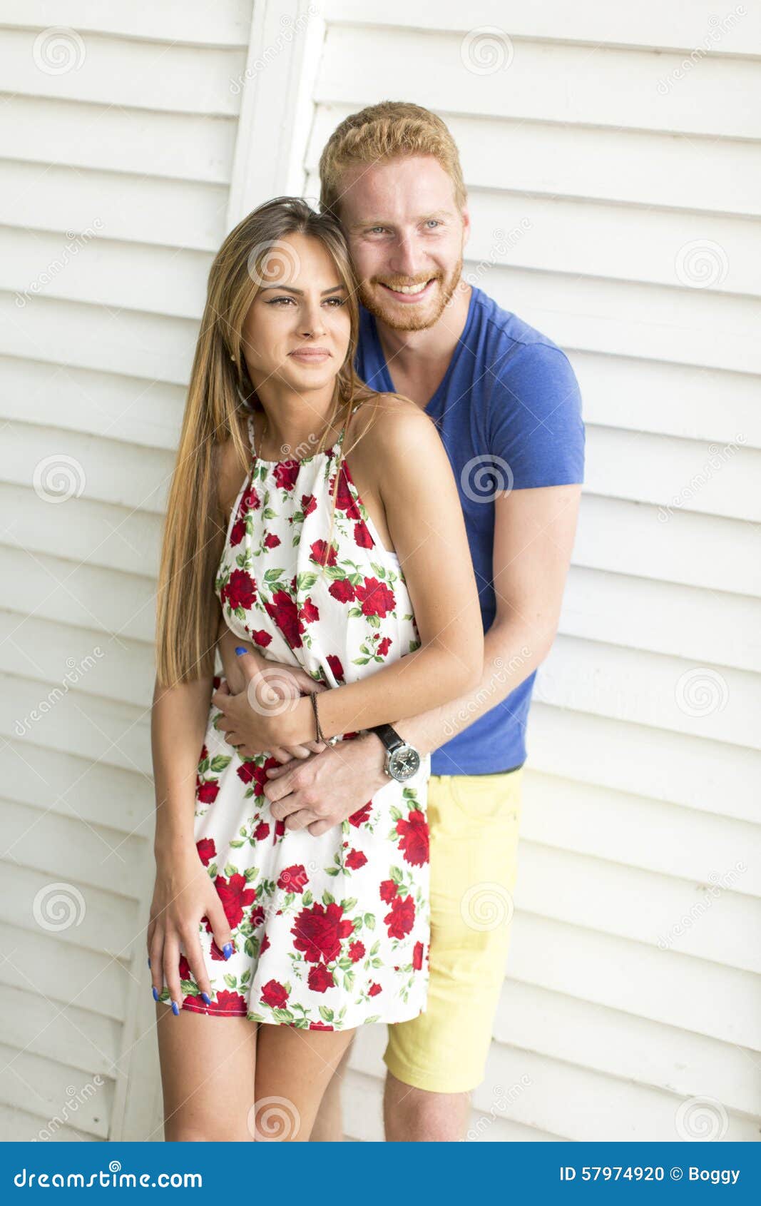 Young couple by the wall stock photo. Image of wall, couple - 57974920