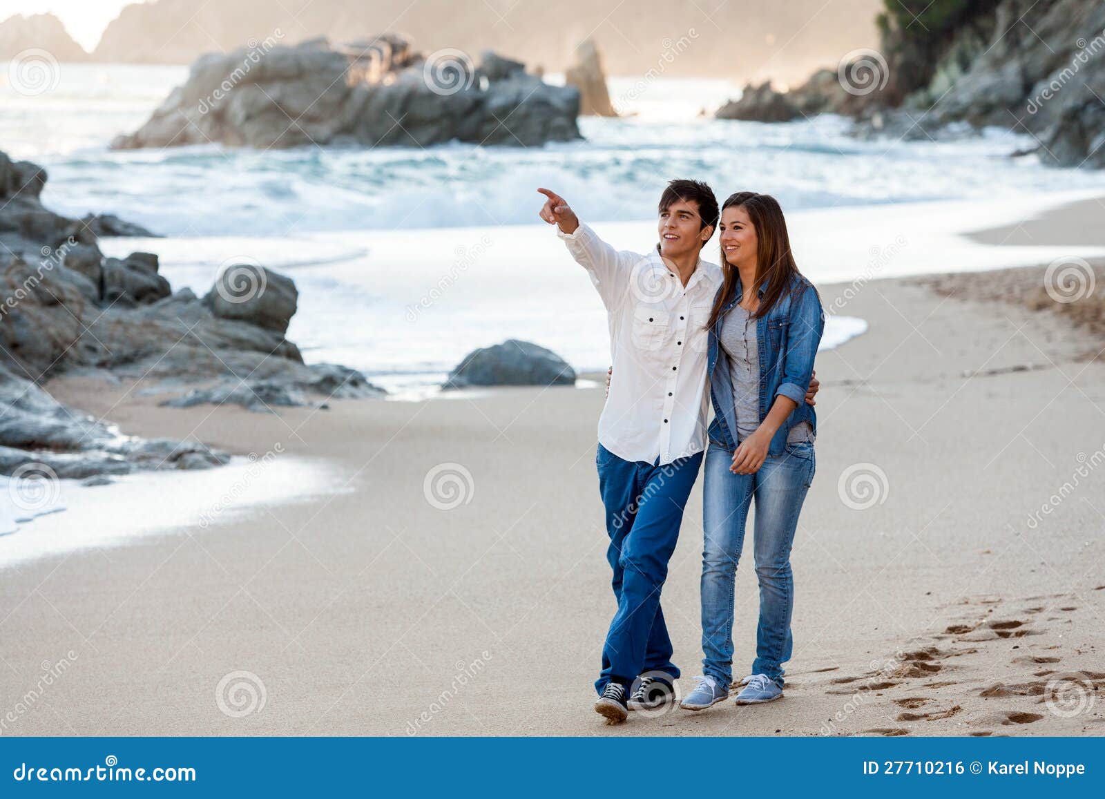 Young Couple Wandering Along Seashore. Stock Photo - Image of ocean ...