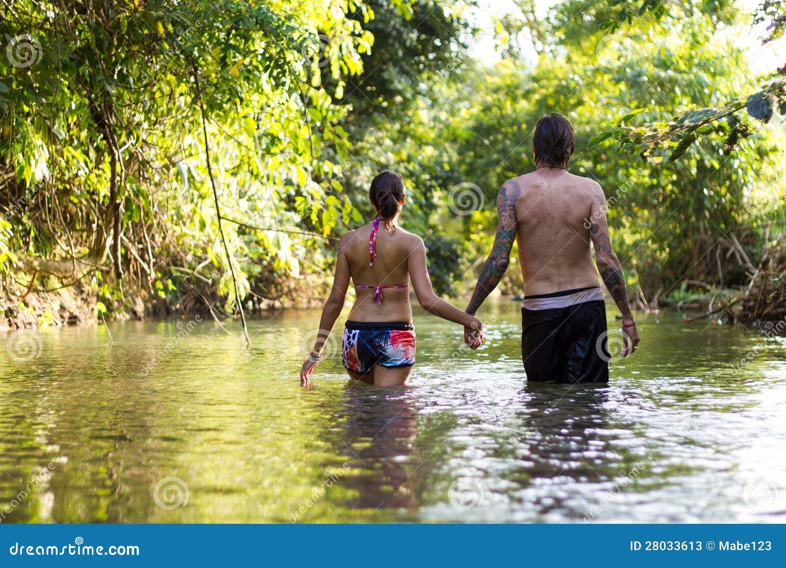 Young couple in water stock image. Image of caucasian - 28033613