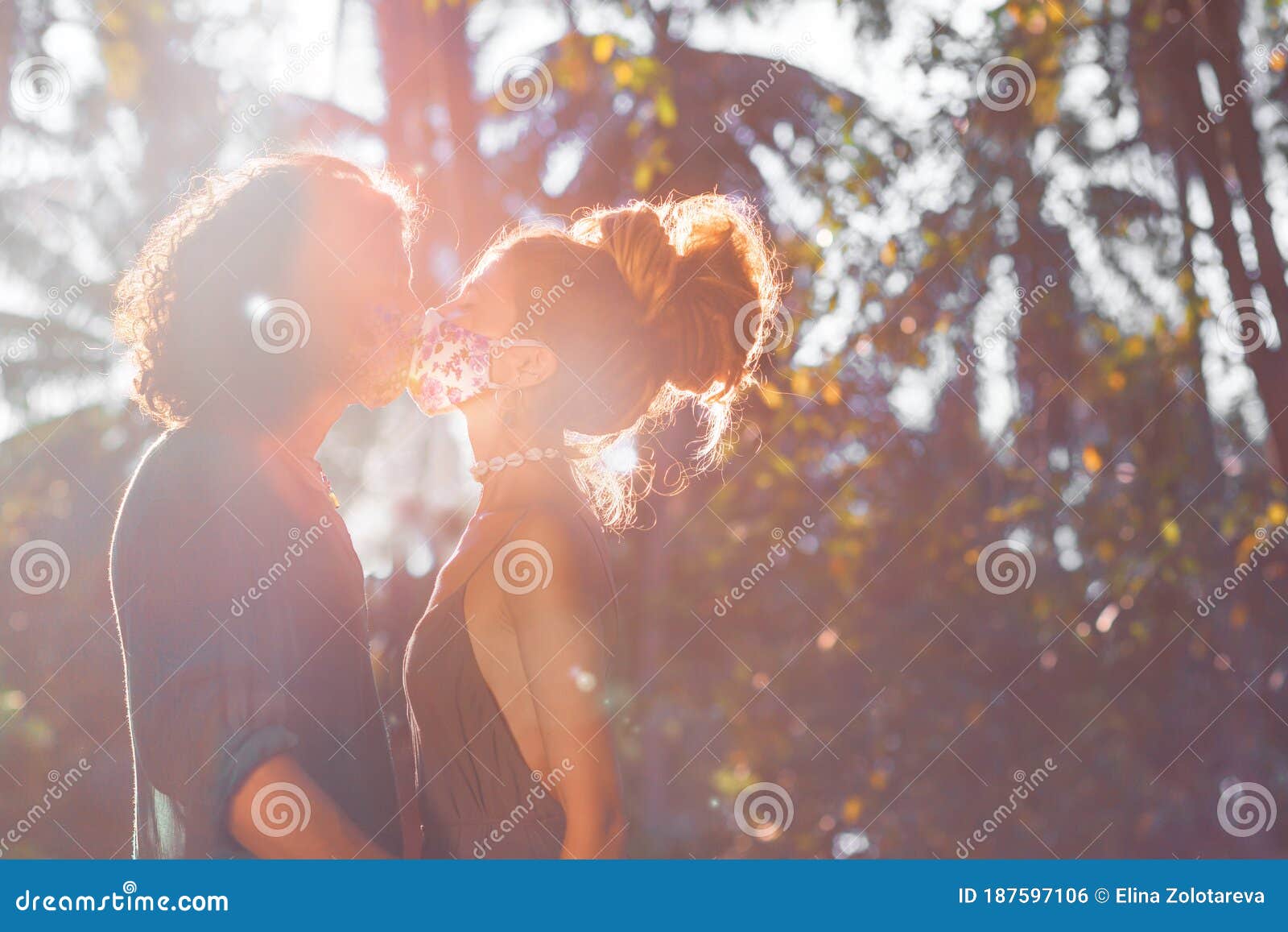 Young Couple Wearing Face Mask Outdoors at Sunset Stock Photo - Image ...