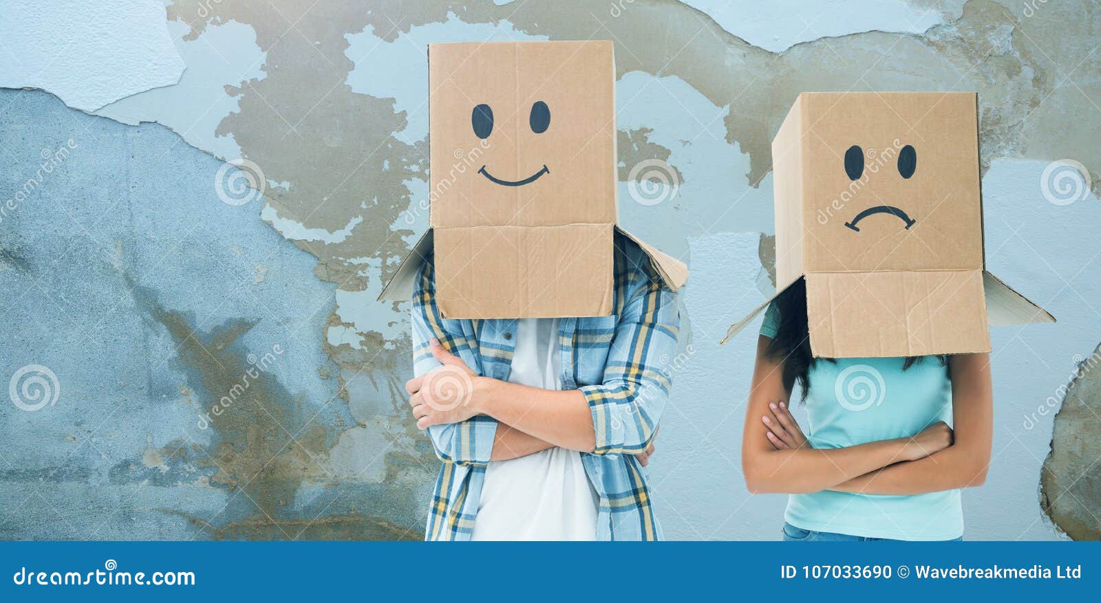 Composite Image of Young Couple Wearing Sad Face Boxes Over Head Stock ...