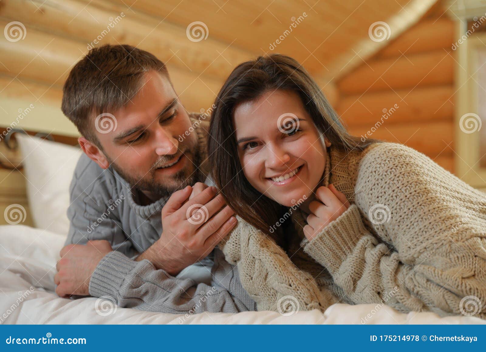 Young Couple Wearing Warm Sweaters on Bed Stock Photo - Image of ...