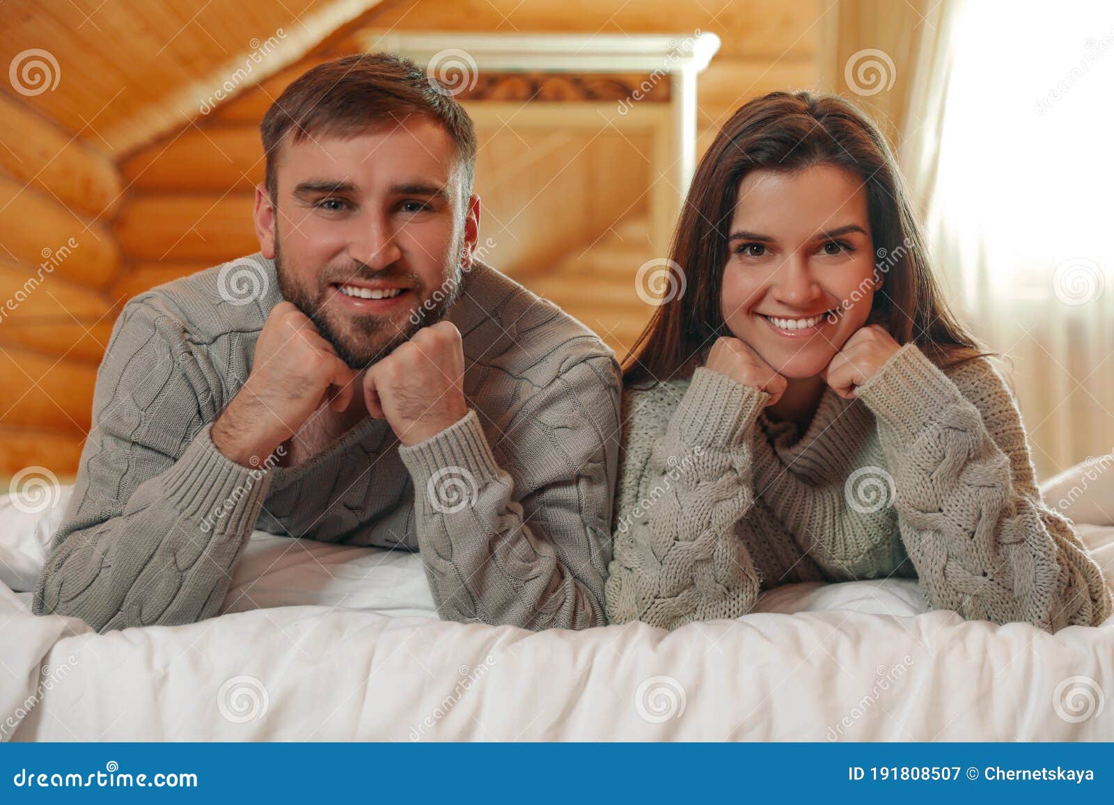 Young Couple Wearing Warm Sweaters on Bed Stock Image - Image of ...
