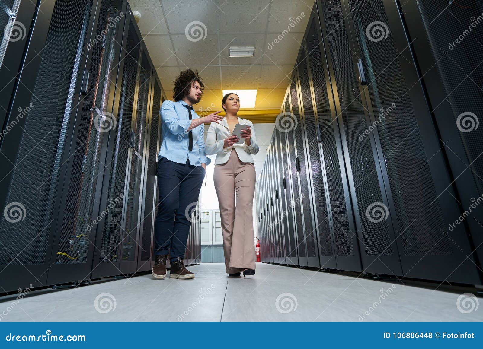 Young Couple Working at a Data Center Stock Photo - Image of portrait ...