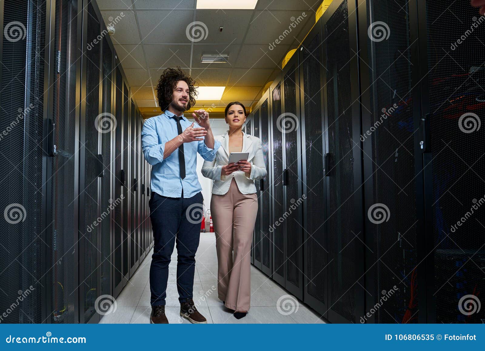 Young Couple Working at a Data Center Stock Image - Image of drive ...