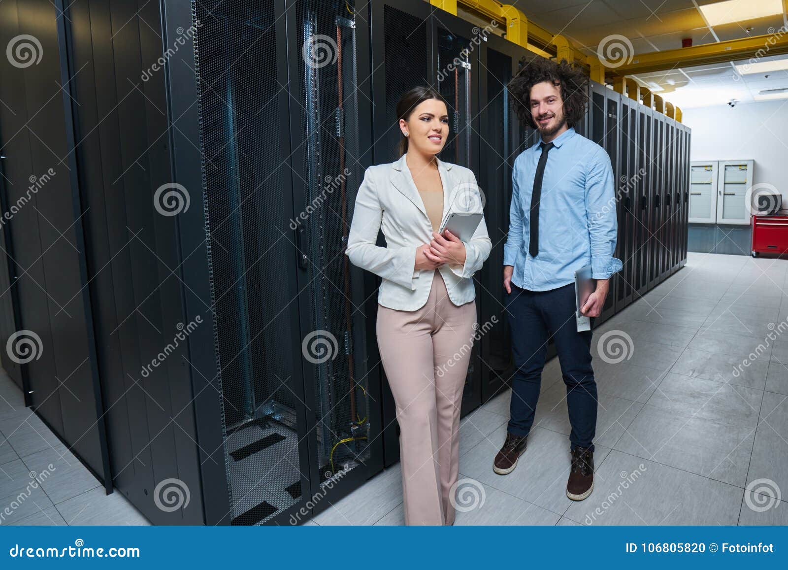 Young Couple Working at a Data Center Stock Photo - Image of ...