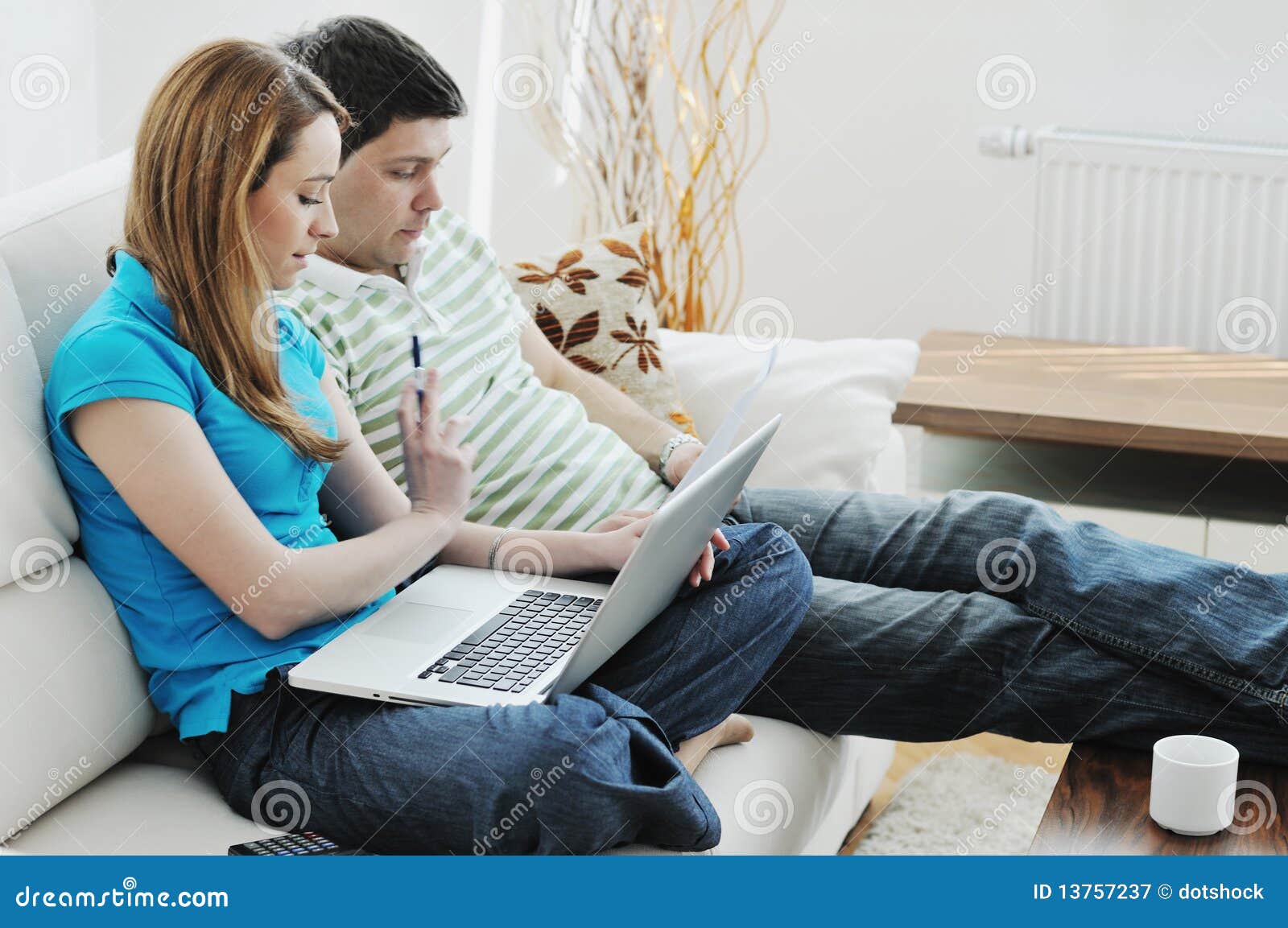 Young Couple Working on Laptop at Home Stock Image - Image of smile ...
