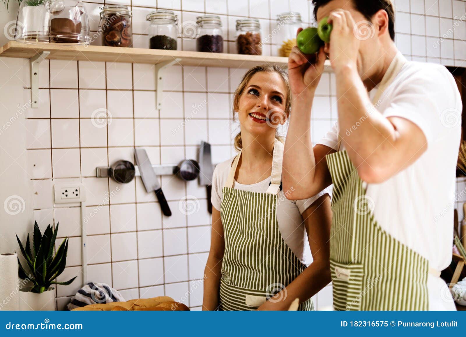 Young Couples are Enjoying Cooking at the Kitchen in Working from Home ...