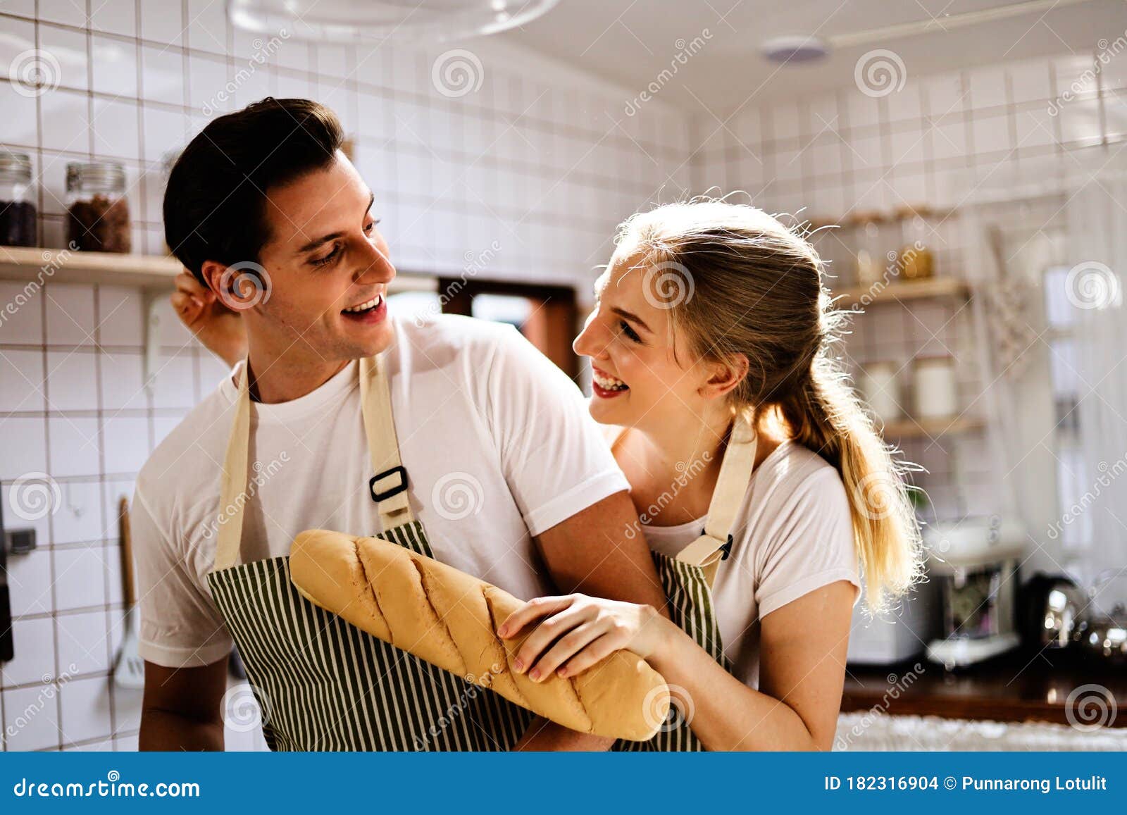 Young Couples are Enjoying Cooking at the Kitchen in Working from Home ...
