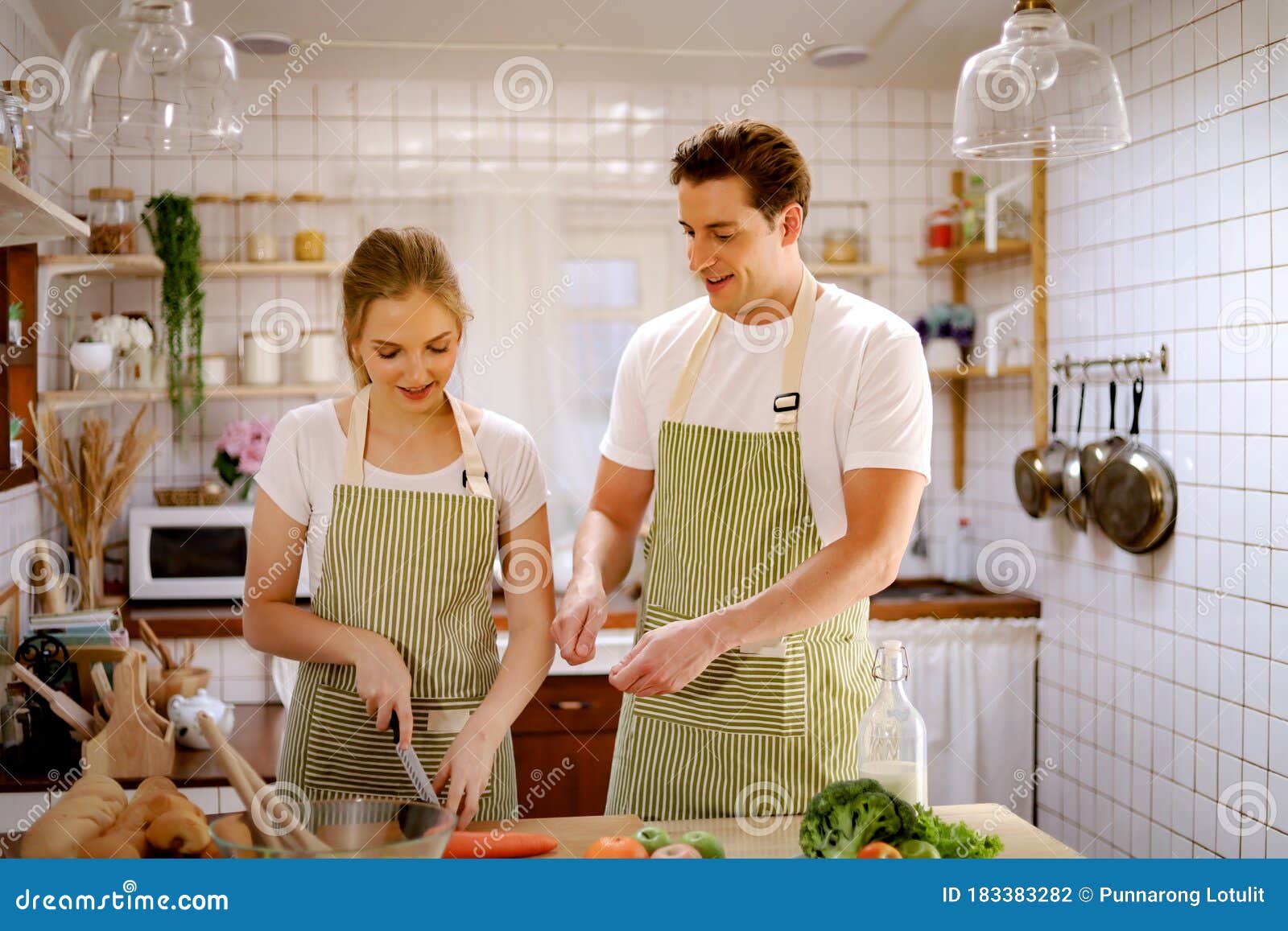 Young Couples are Enjoying Cooking at the Kitchen in Working from Home ...