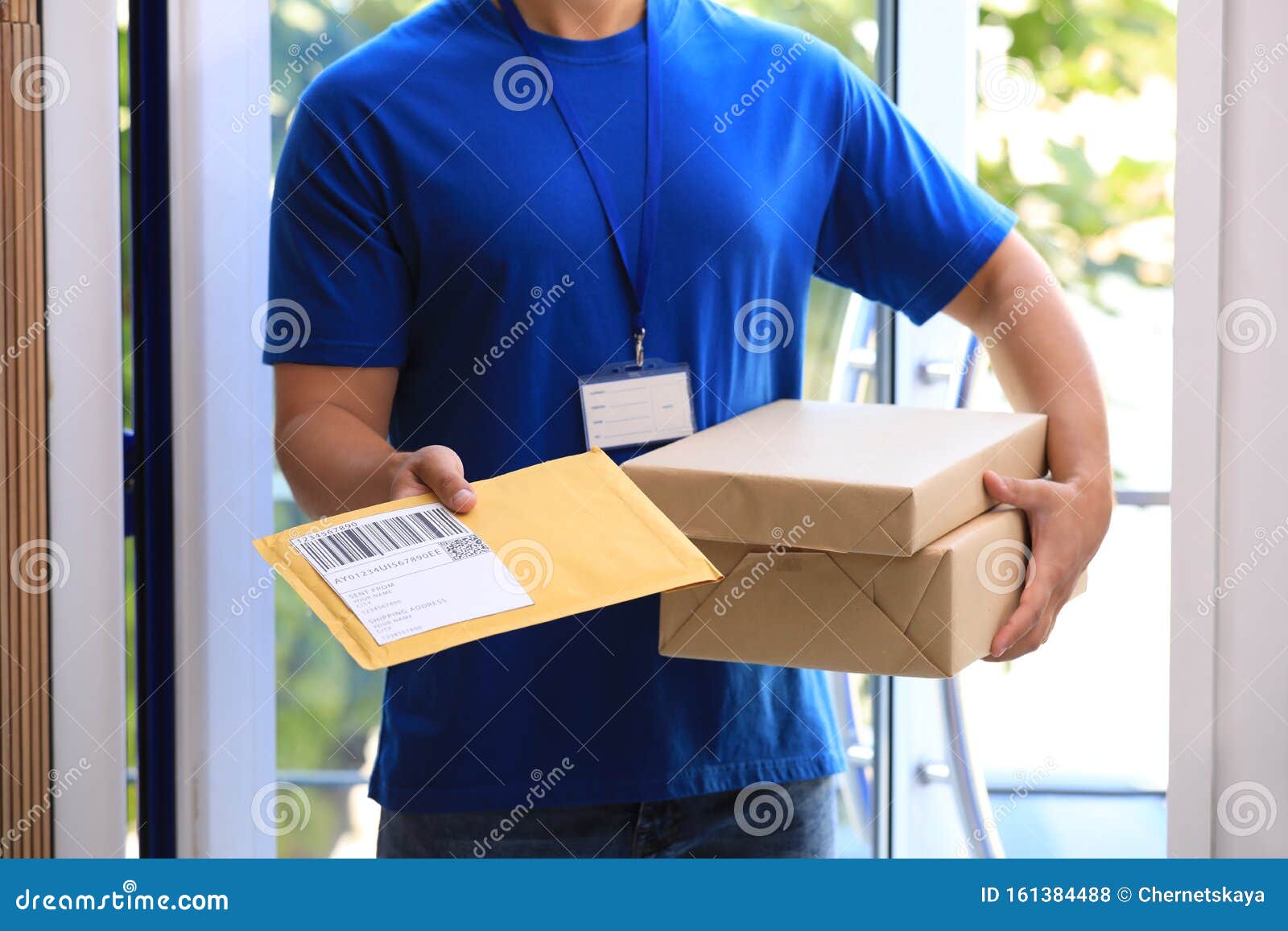 Young Courier Delivering Parcels on Doorstep Stock Photo - Image of ...