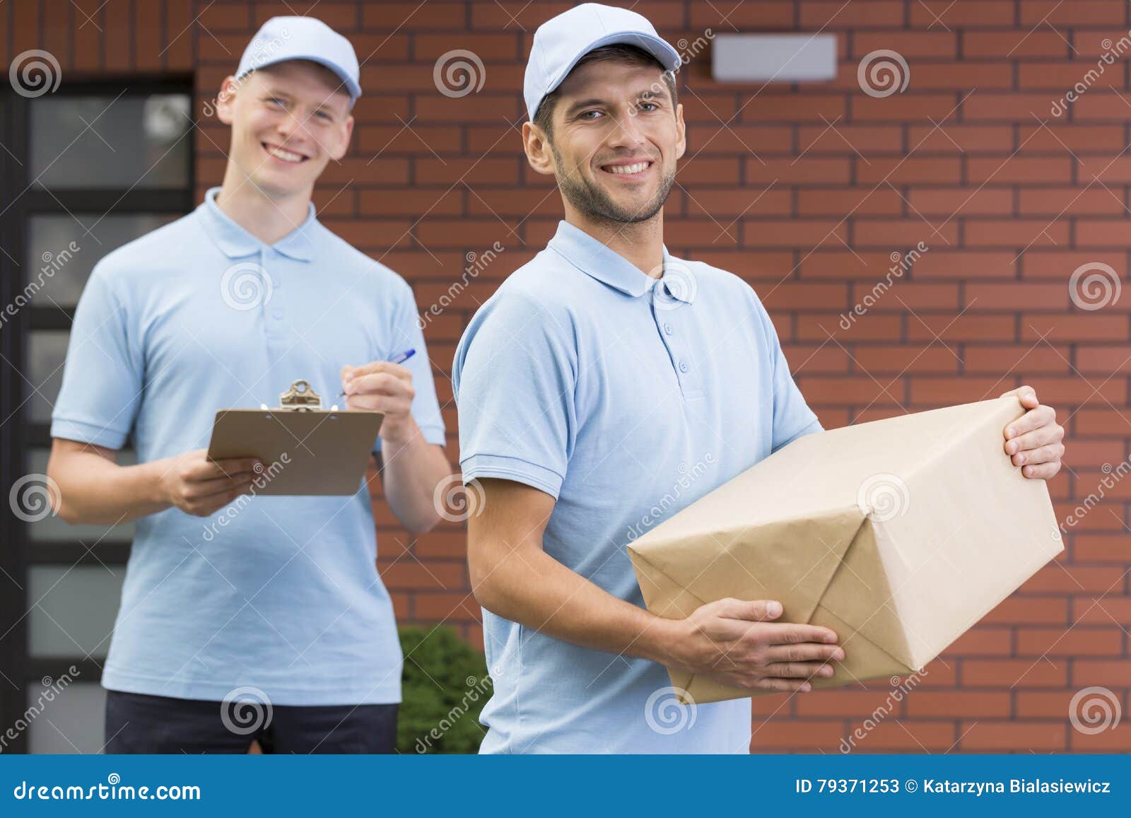 Young Couriers with Package and Clipboard Stock Image - Image of worker ...