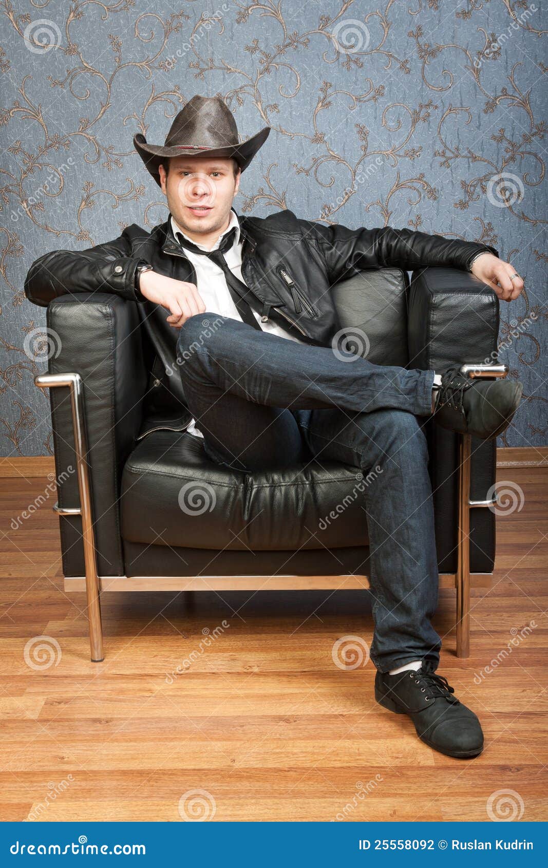 Young Cowboy Sitting in Leather Chair Stock Photo - Image of rocking ...
