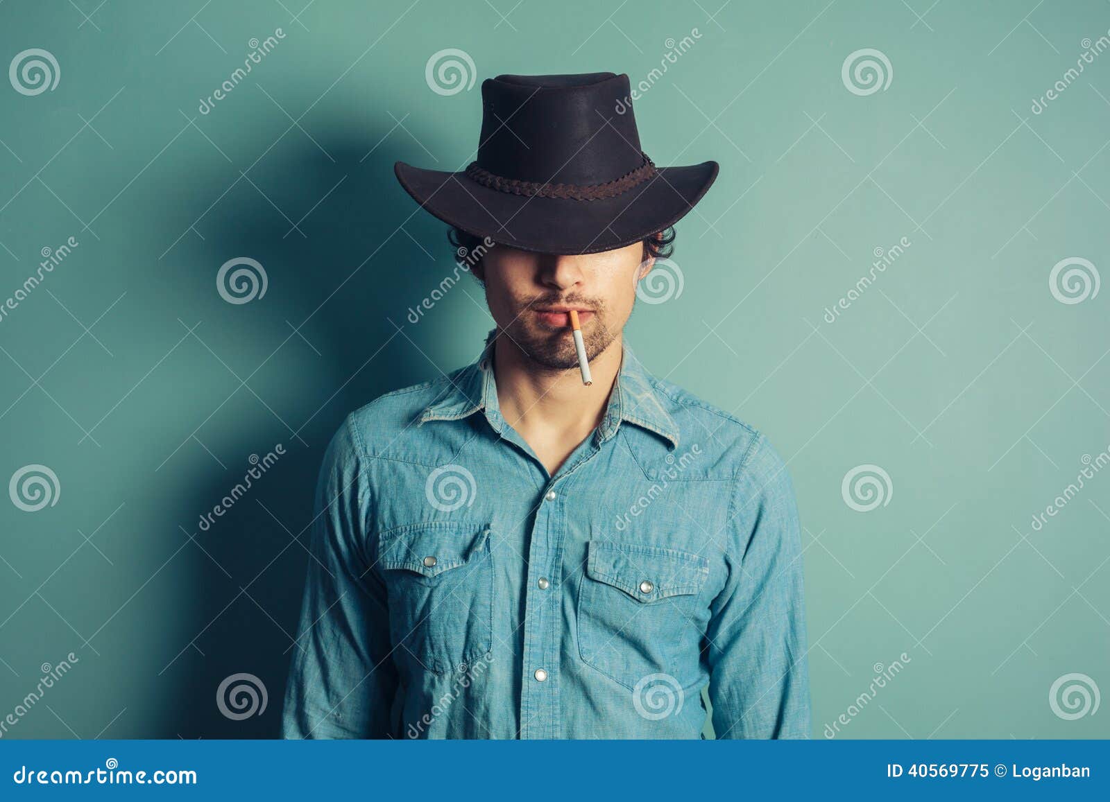 Young Cowboy Smoking Cigarette Stock Image - Image of sumbol, country ...