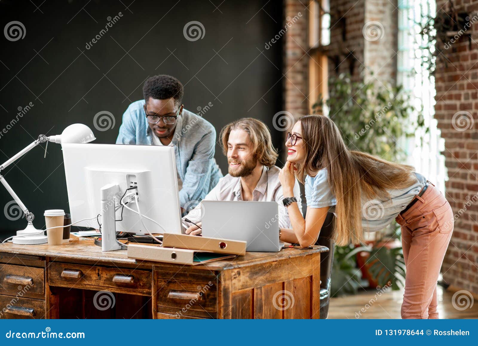 Young Coworkers Working with Computer Indoors Stock Photo - Image of ...