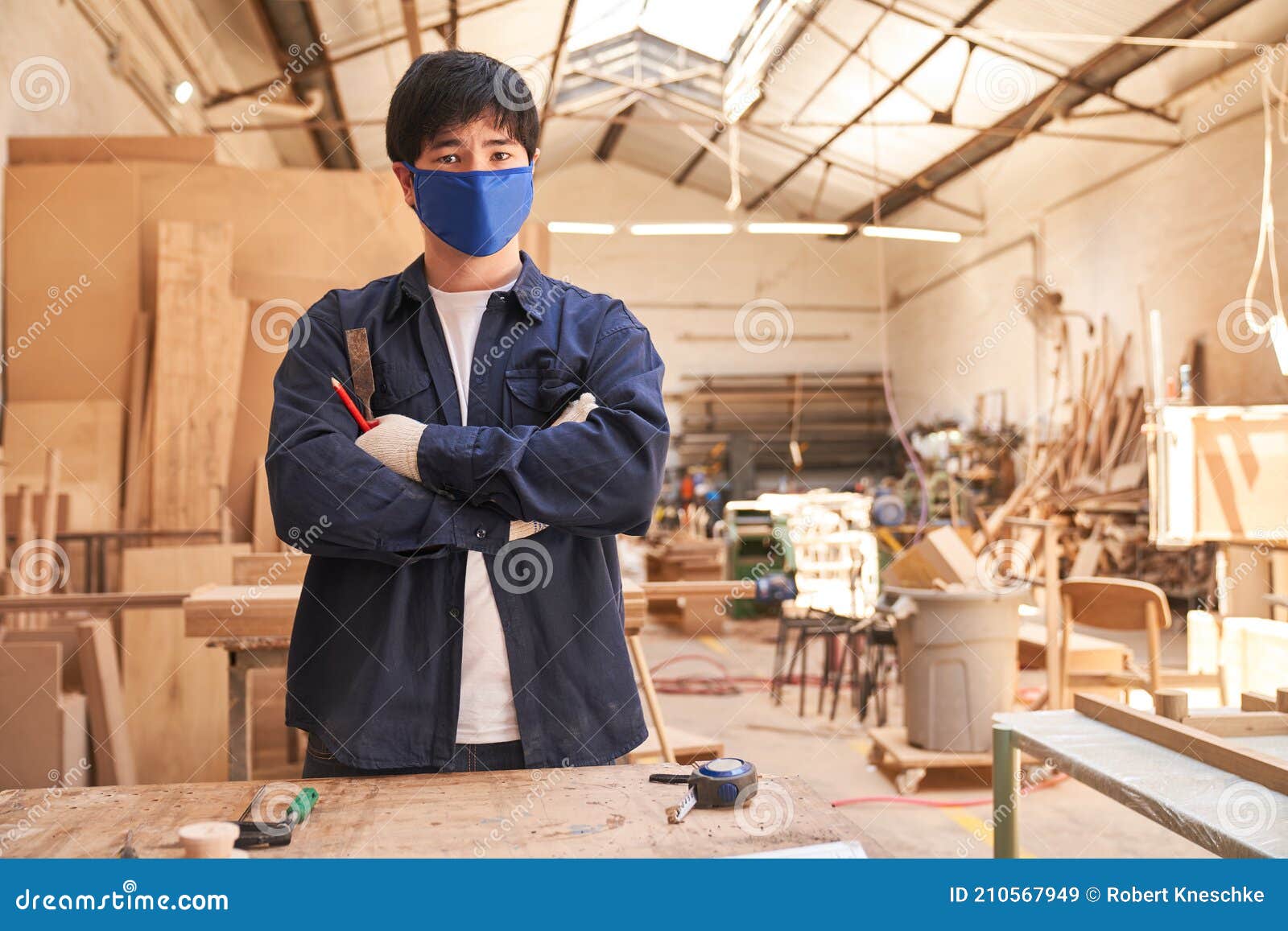 Young Craftsman Apprentice with Face Mask Stock Image - Image of ...