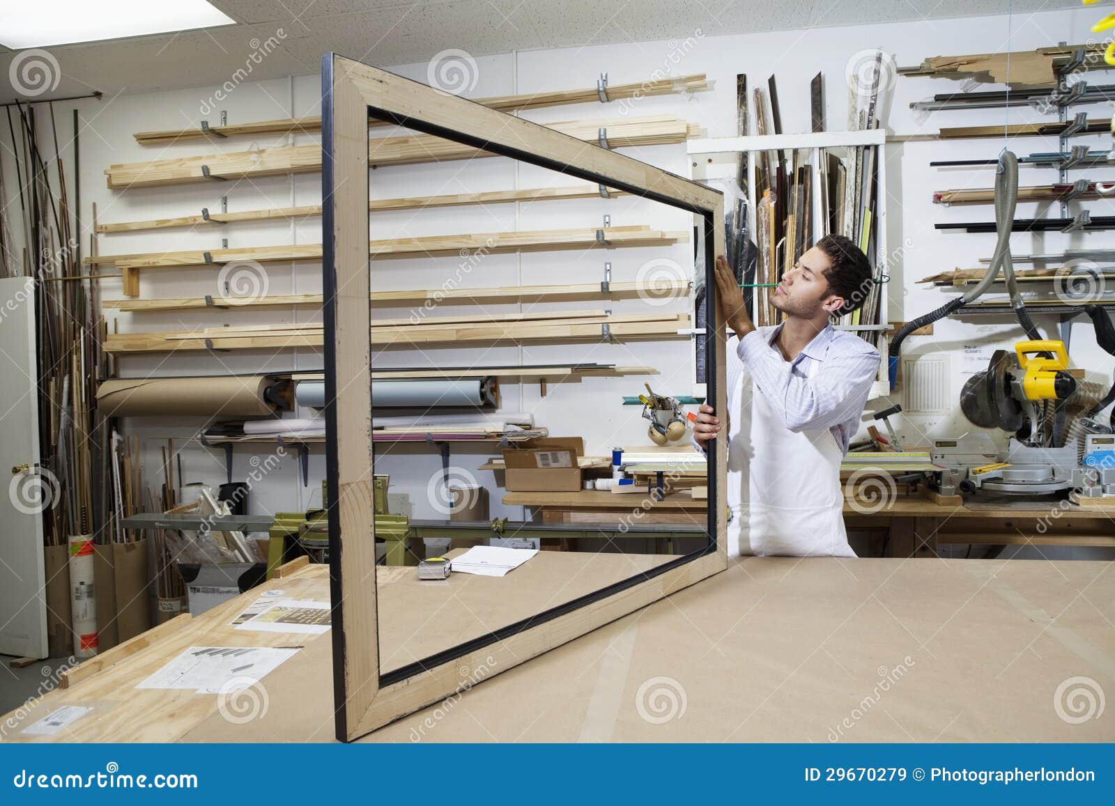 Young Craftsman Concentrating on Making Picture Frame in Workshop Stock ...