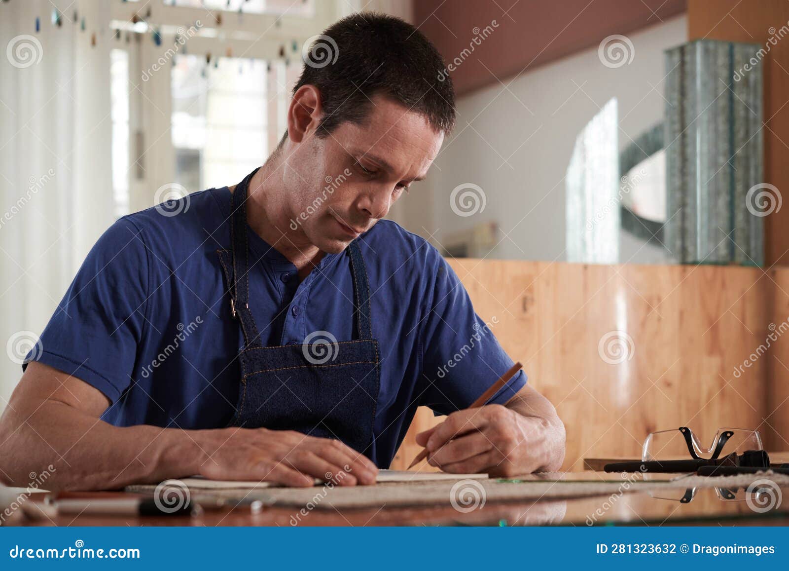 Young Craftsman Drawing Sketches in Notepad Stock Photo - Image of ...