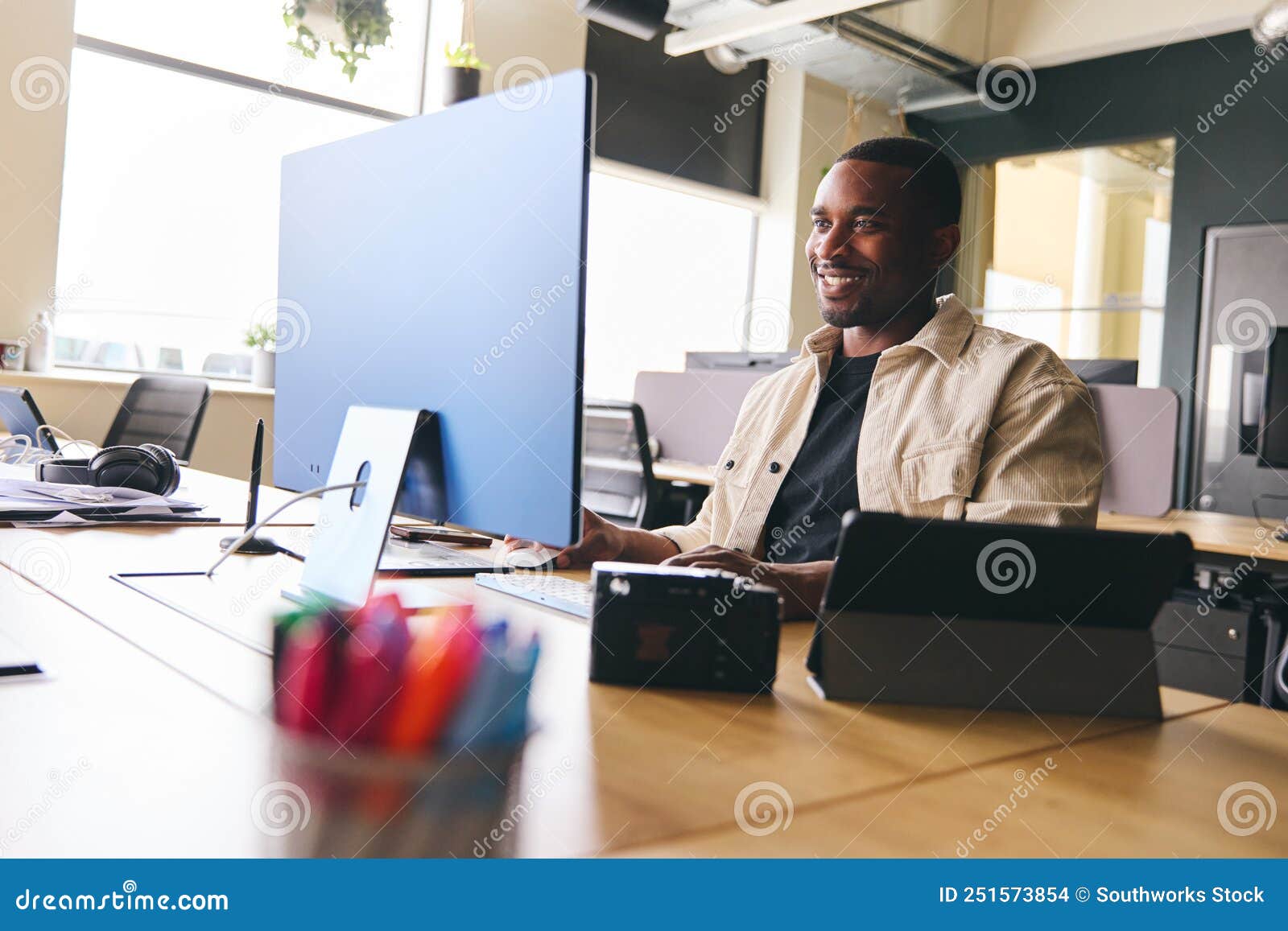 Young Creative Man Working on Computer in Modern Office at Desk Smiling ...