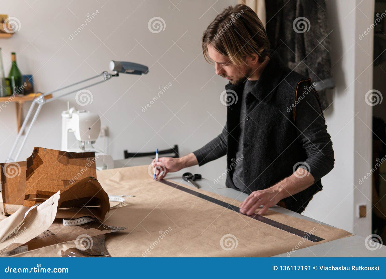 Young Creative Man Tailor Draws Clothing Pattern in Workshop Stock ...