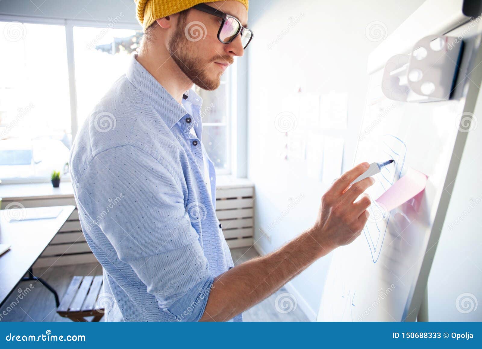 Young Creative Man Writing Down Ideas on Wall Full of Sticky Notes ...