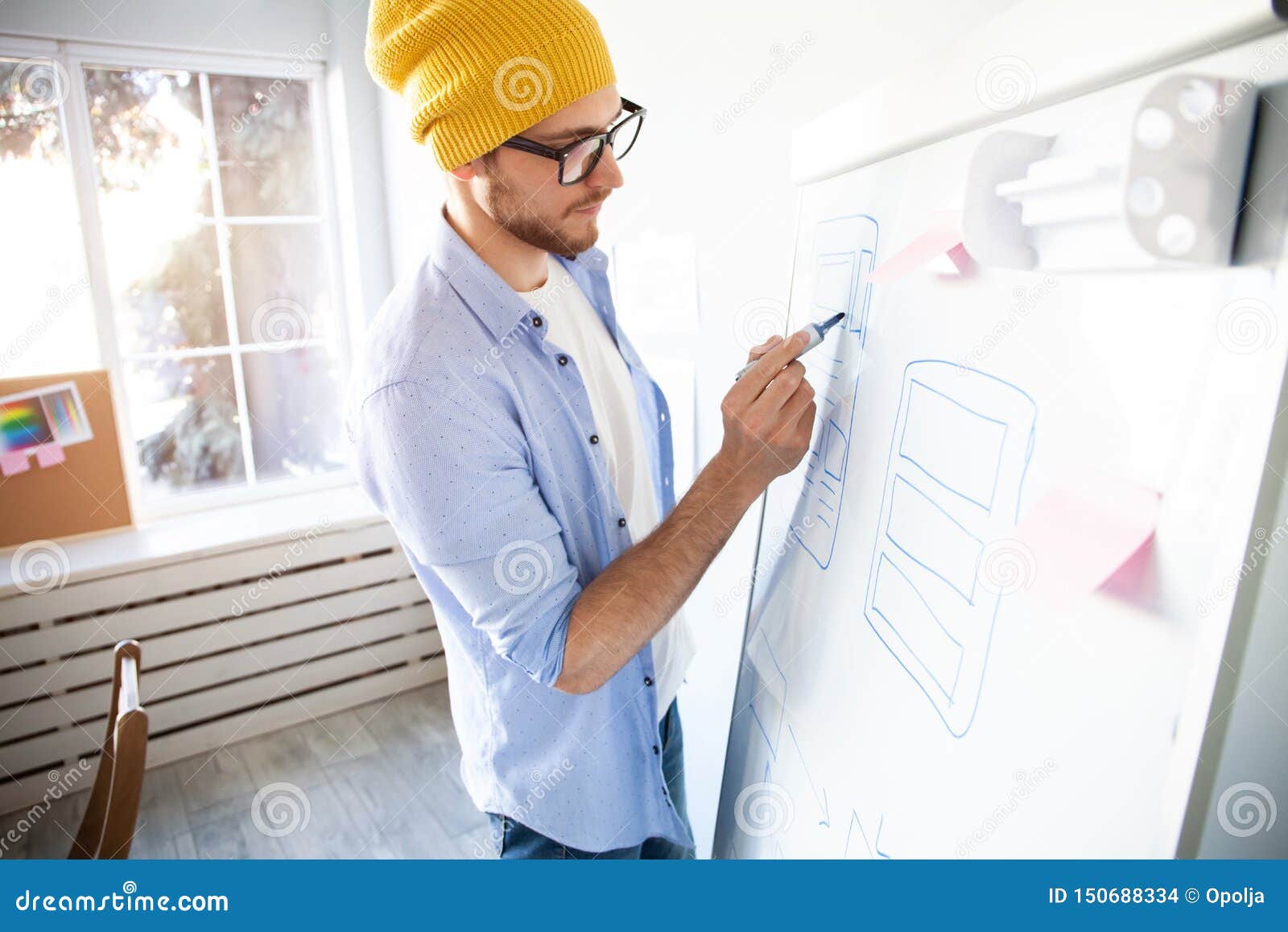 Young Creative Man Writing Down Ideas on Wall Full of Sticky Notes ...