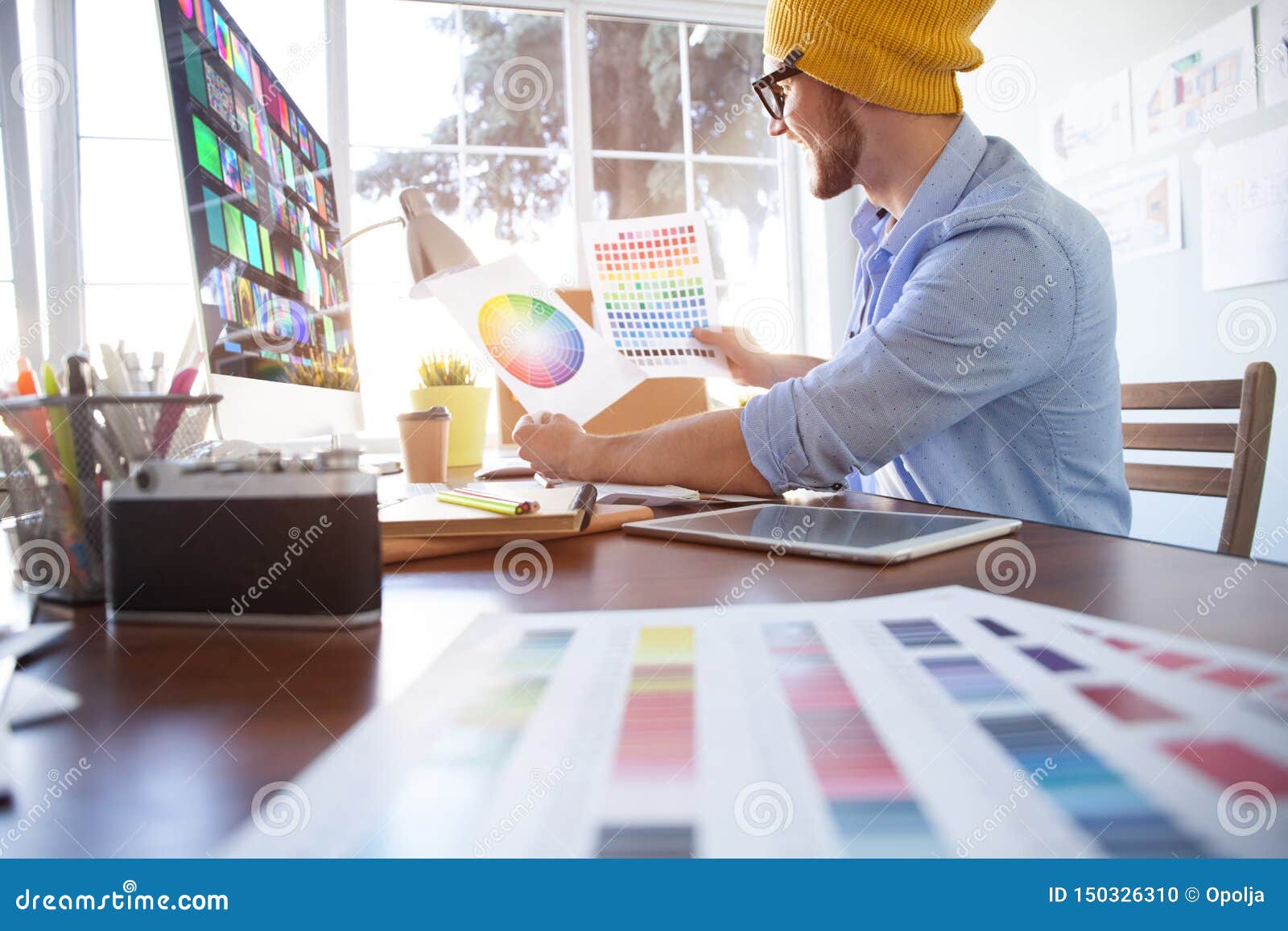 Young Creative Manager Sitting at His Table and Working on Computer ...