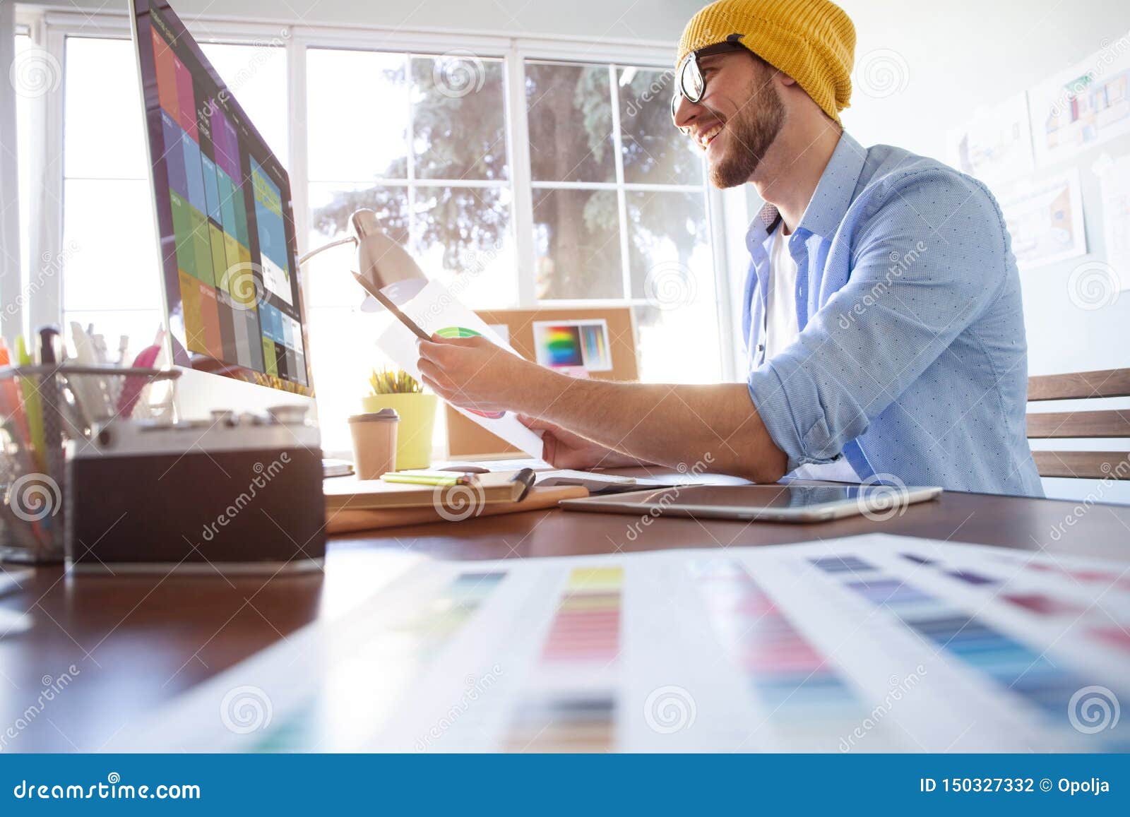 Young Creative Manager Sitting at His Table and Working on Computer ...