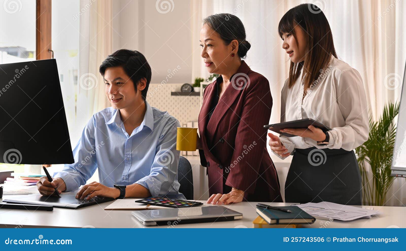 Young Creative People and Senior Female Project Manager are ...