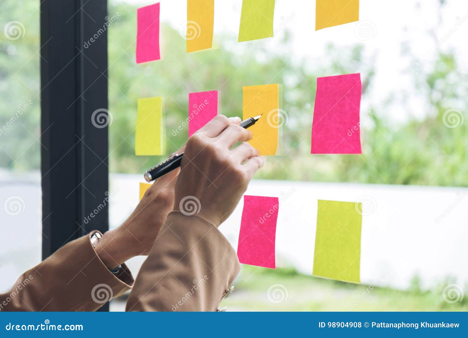 Young Creative Professional Leader Using Post it Notes in Glass Stock ...