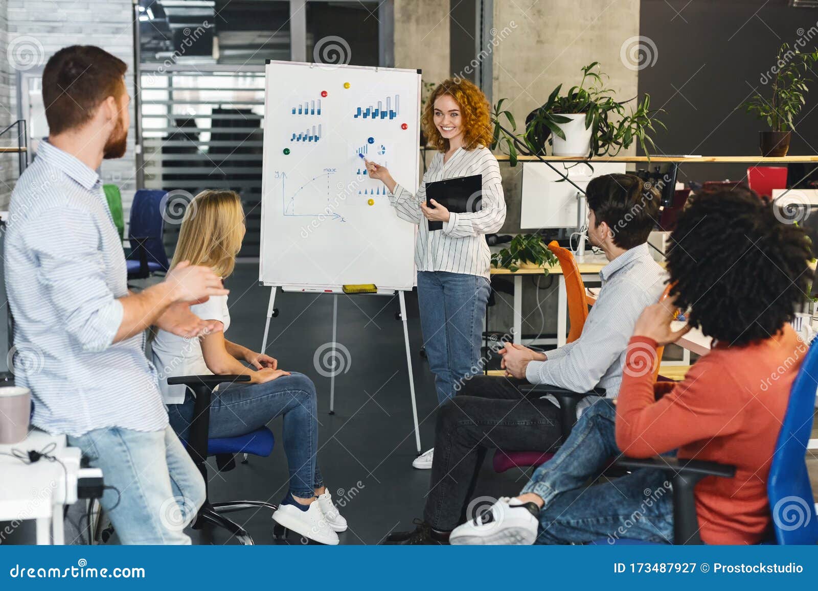 Young Creative Team Analyzing Information on Graphs and Charts Stock ...