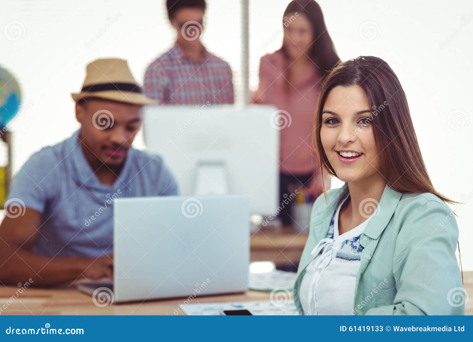 Young Creative Workers Smiling at Camera Stock Image - Image of ...