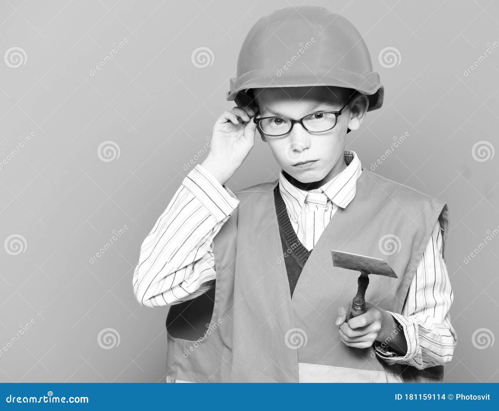Young Cute Builder Boy on Blue Studio Background,copy Space Stock Photo ...