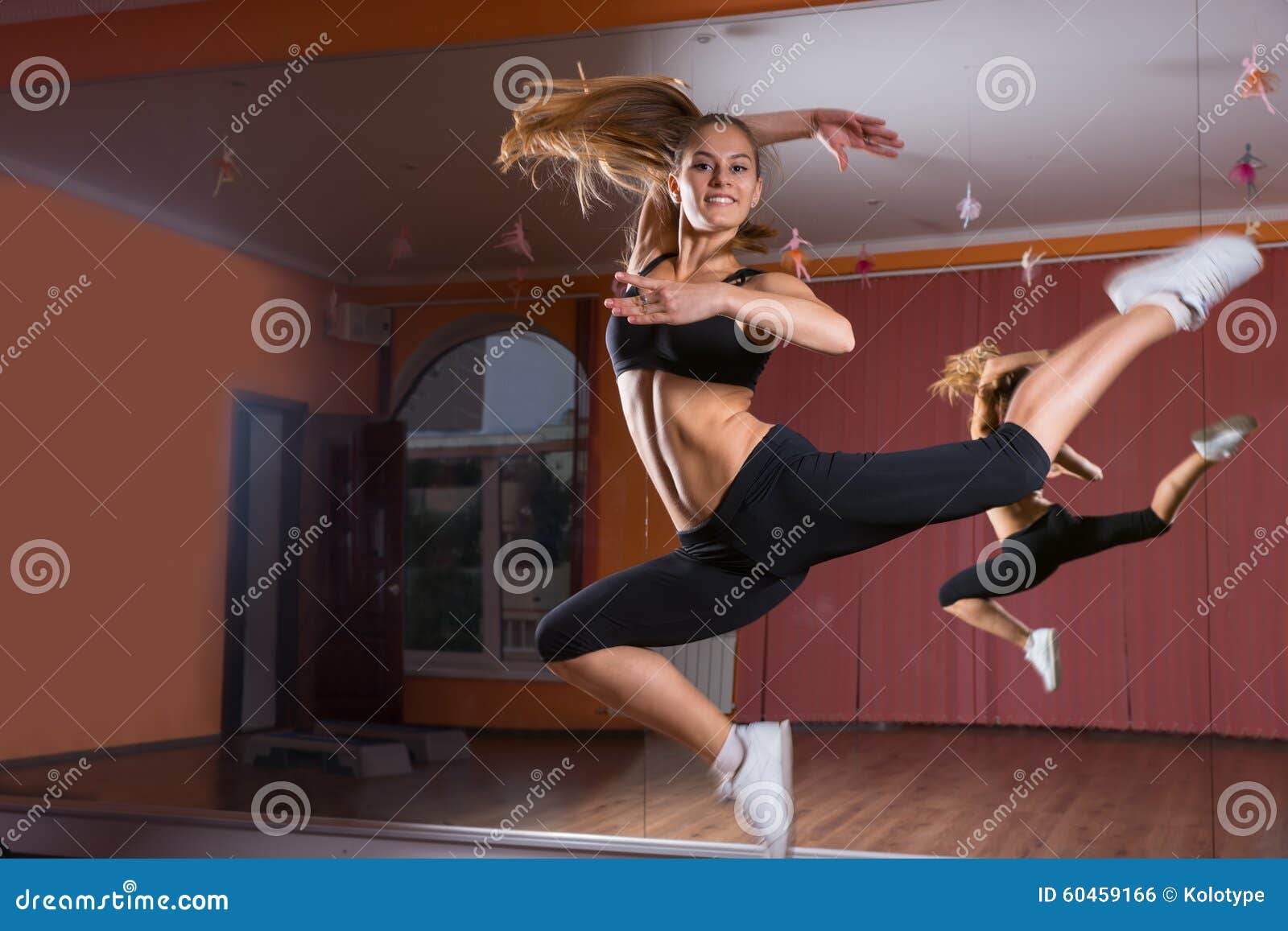 Young Dancer Leaping in Air in Dance Studio Stock Photo - Image of ...