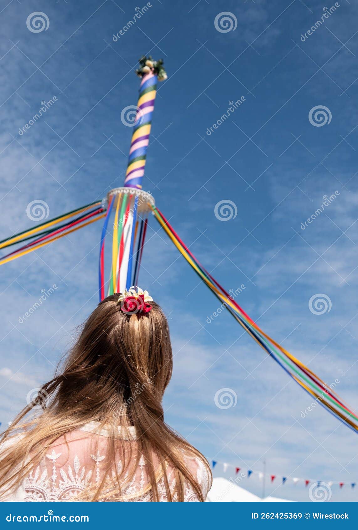 Young Dancer Looking at the Pole with Colored Ribbons on a Traditional ...