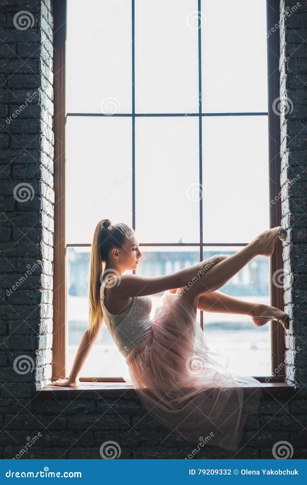 Young Dancer Posing at Camera Near Window Stock Photo - Image of ...