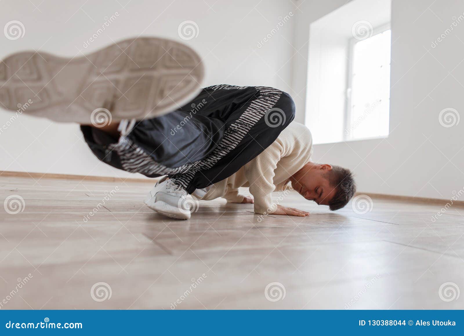 Young Dancer Standing on the Arm. Man Dancing Breakdance Stock Photo ...