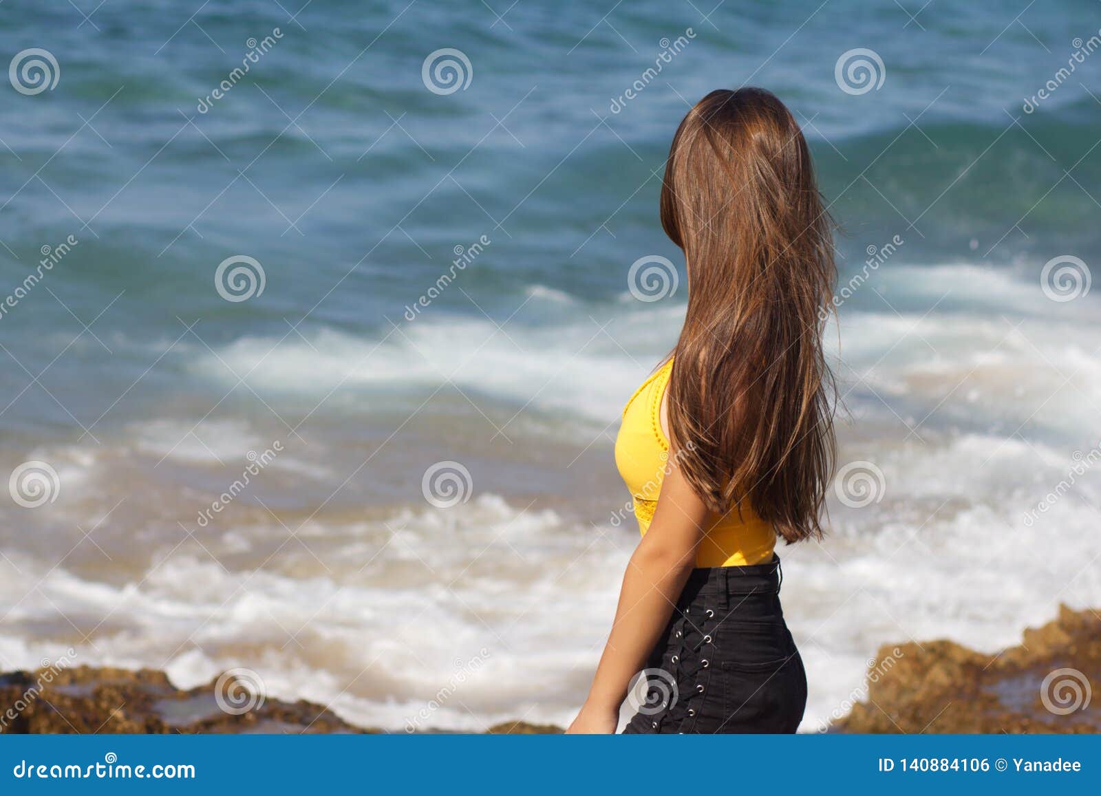 Young Dark Haired Beautiful European Girl In Yellow Swimsuit Stock