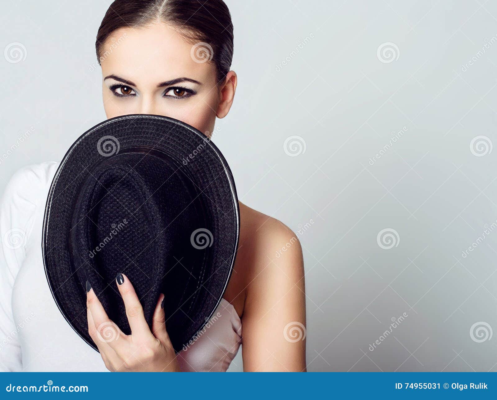 Young Dark Haired Girl Hiding Her Face Behind The Hat Stock Image Image Of Face Beauty 74955031