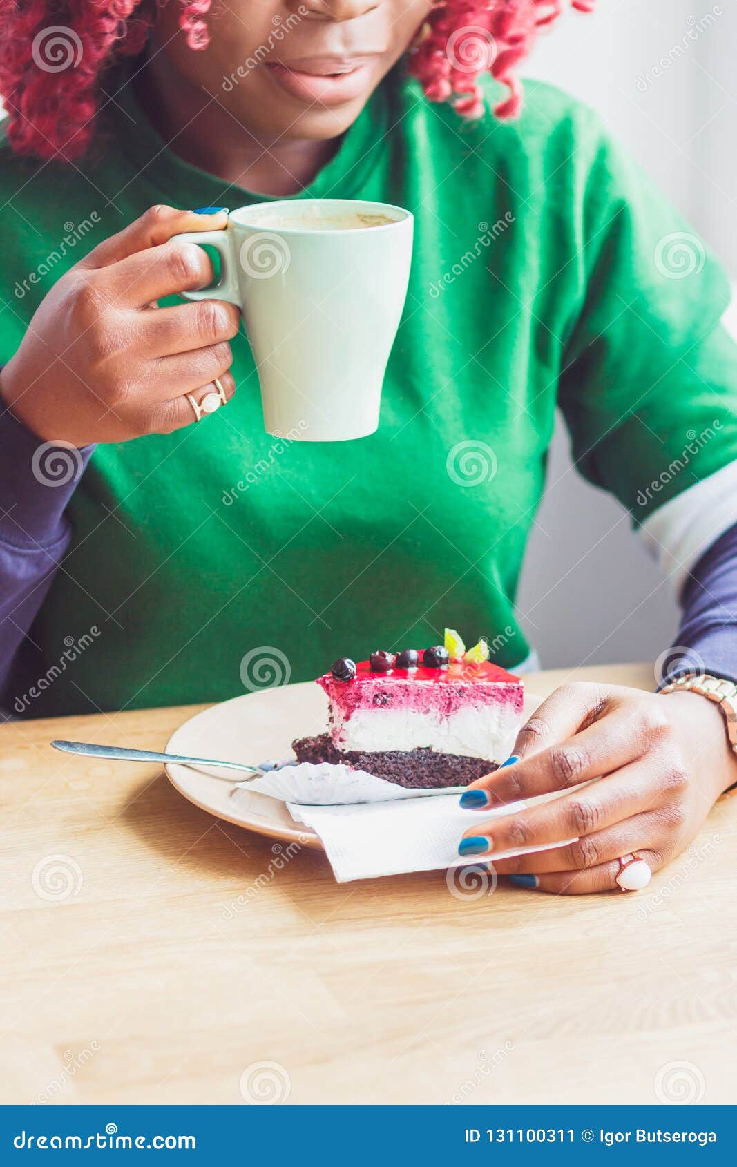 Young Dark Skinned Woman Dressed In Casual Clothes Holding Cup Of Hot