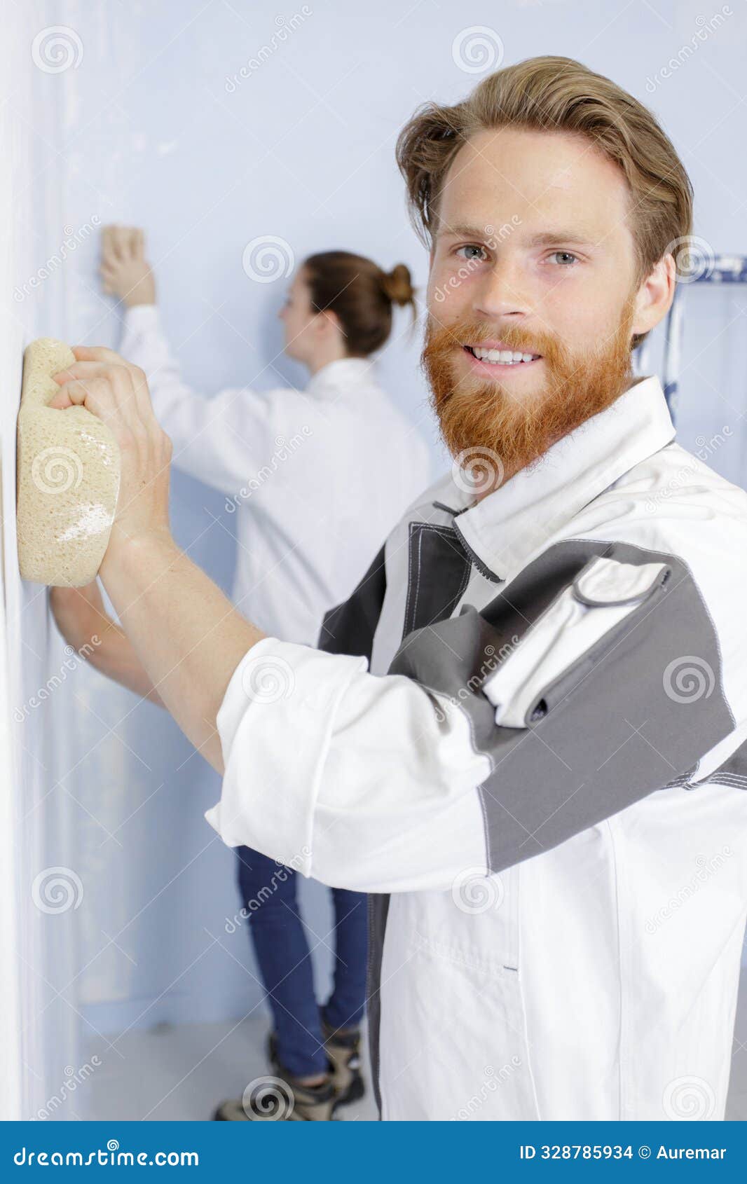 Young Decorator Finishing Wall with Sponge Float Stock Photo - Image of ...