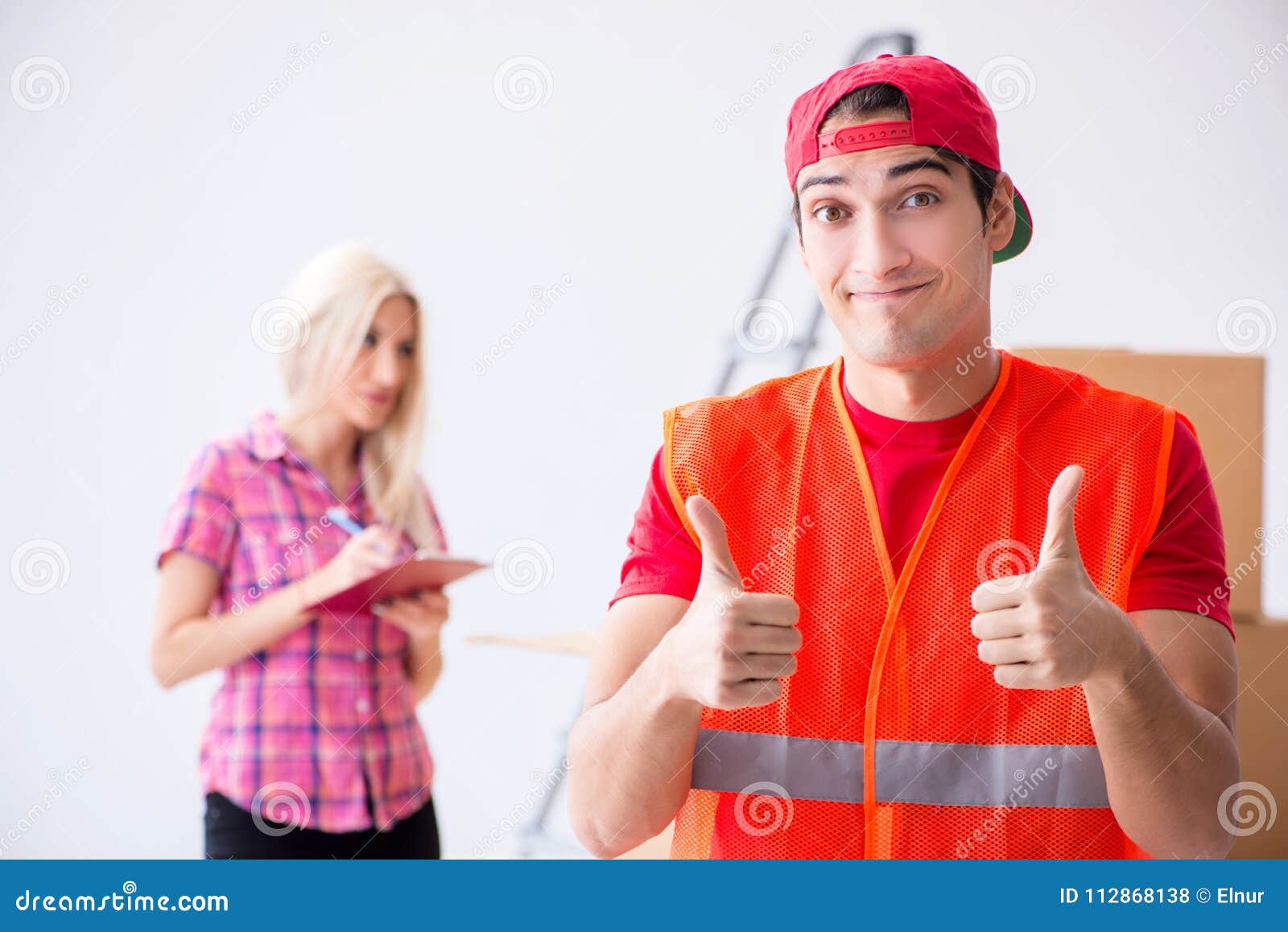The Young Delivery Assistant Delivering To Home Stock Photo - Image of ...