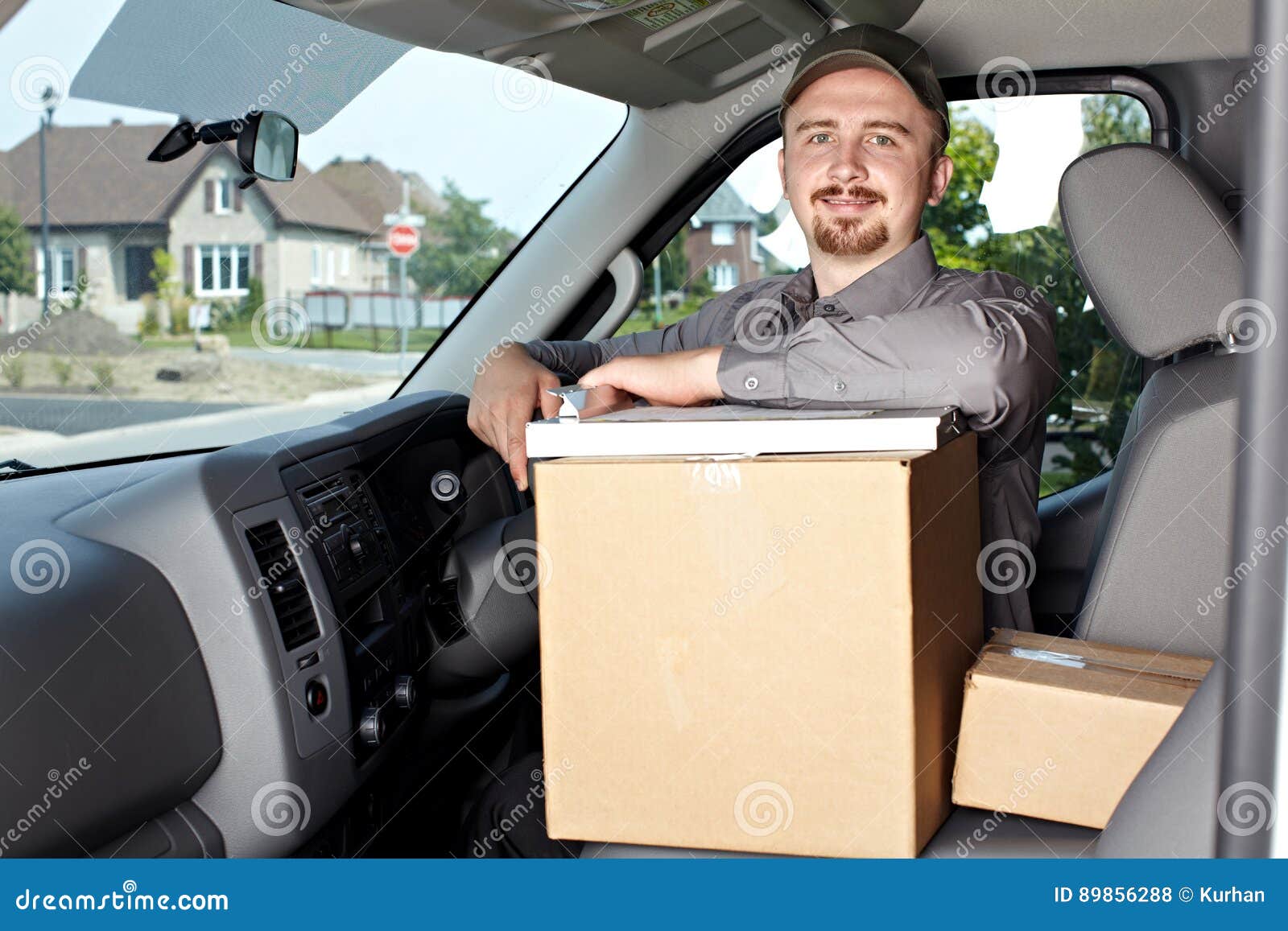 Young Delivery Man in the Car. Stock Photo - Image of postboy, business ...