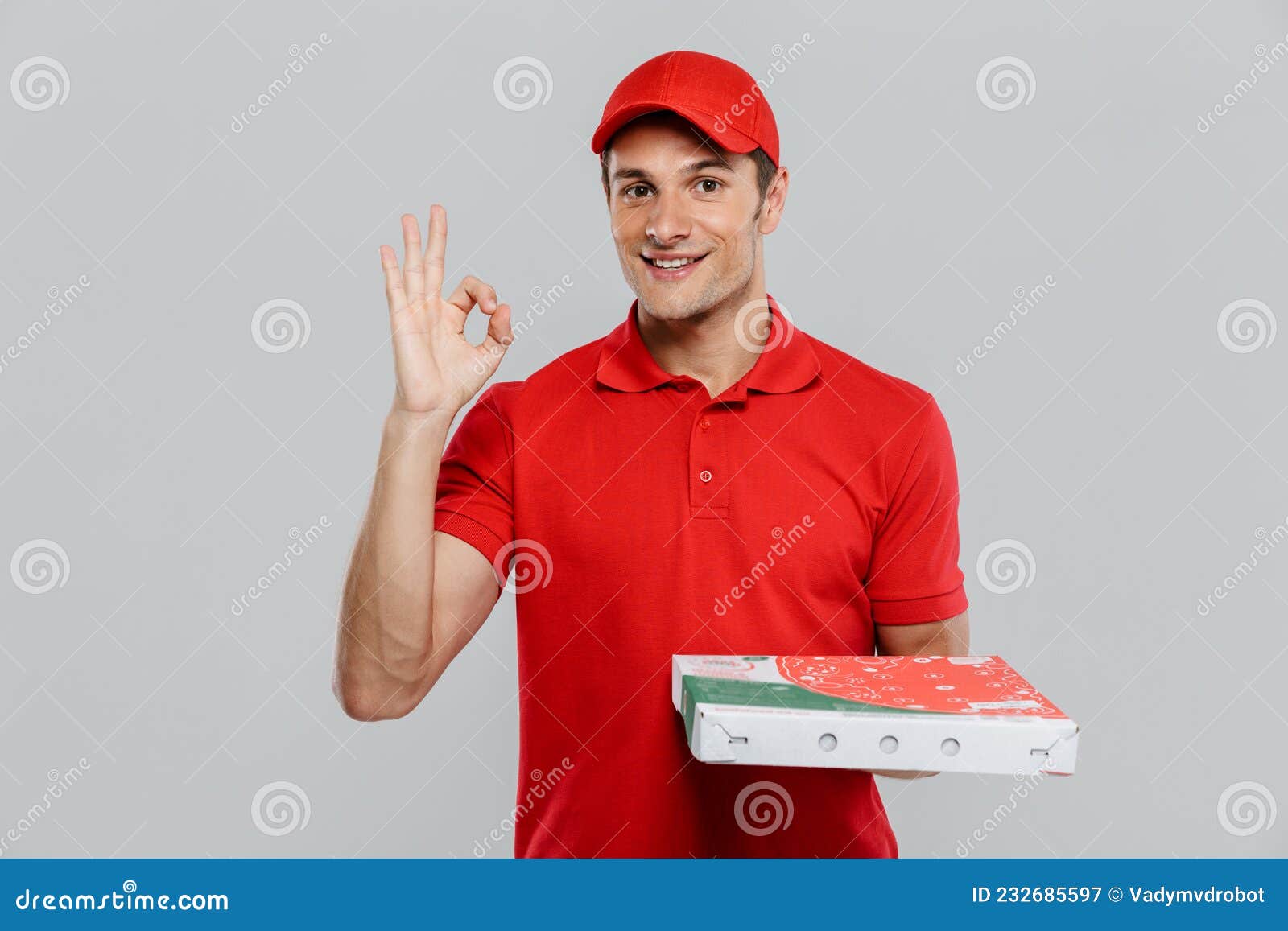 Young Delivery Man in Hat Gesturing while Posing with Pizza Box Stock ...