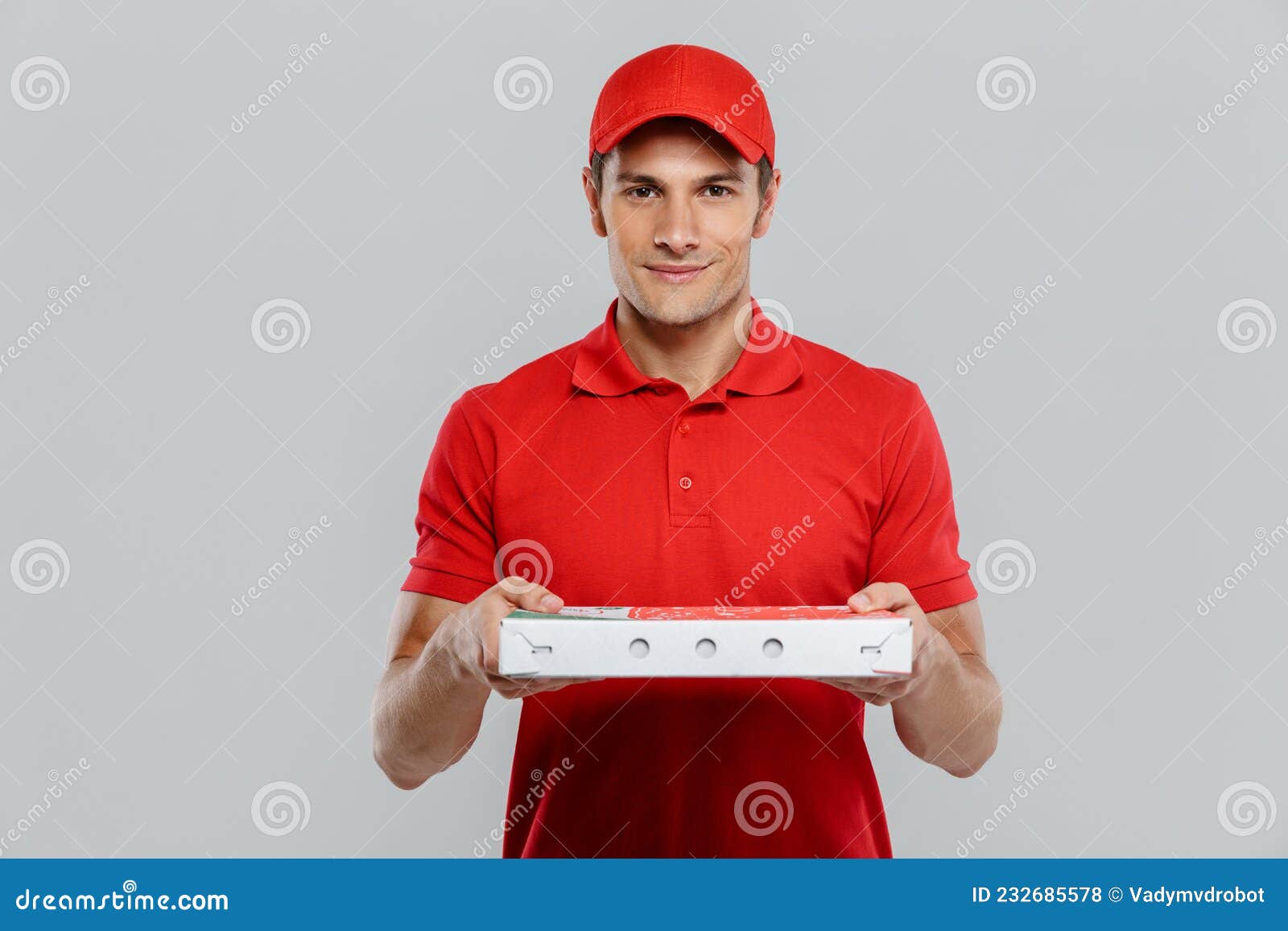 Young Delivery Man in Hat Smiling while Posing with Pizza Box Stock ...